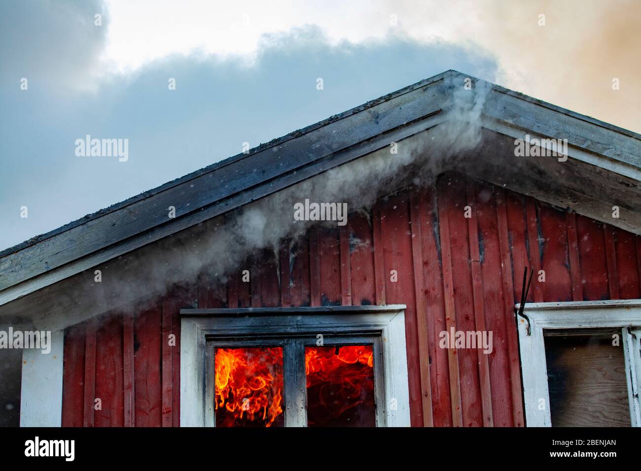 Firefighters trying to save burning house Stock Photo - Alamy