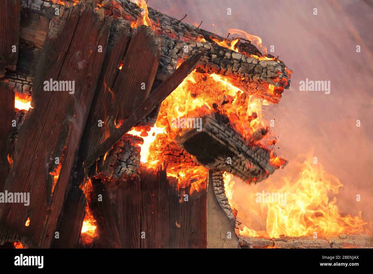 Firefighters trying to save burning house Stock Photo - Alamy
