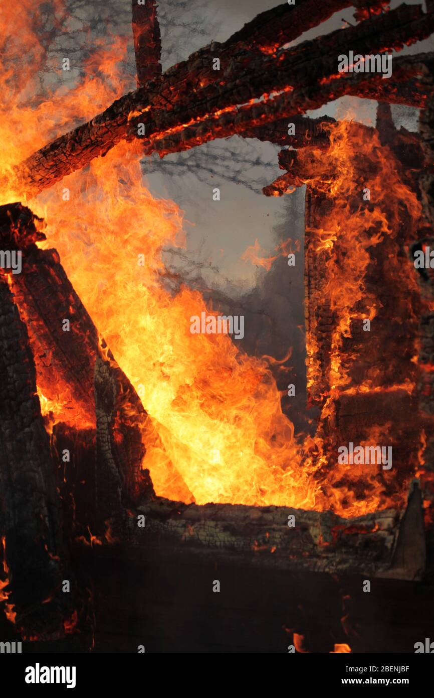 Firefighters trying to save burning house Stock Photo - Alamy