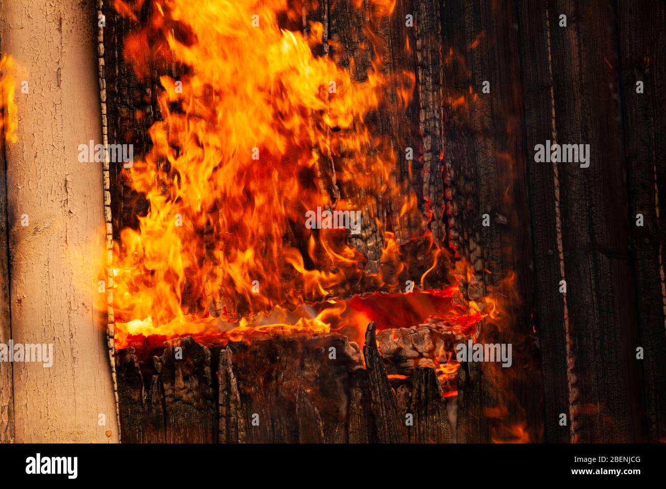 Firefighters trying to save burning house Stock Photo - Alamy