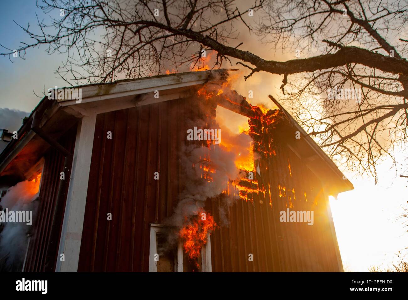 Firefighters trying to save burning house Stock Photo - Alamy