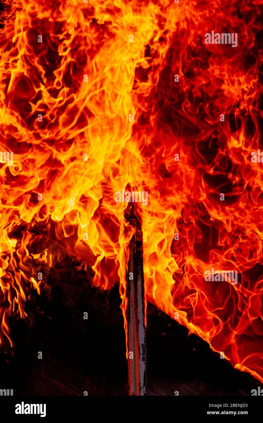 Firefighters trying to save burning house Stock Photo - Alamy