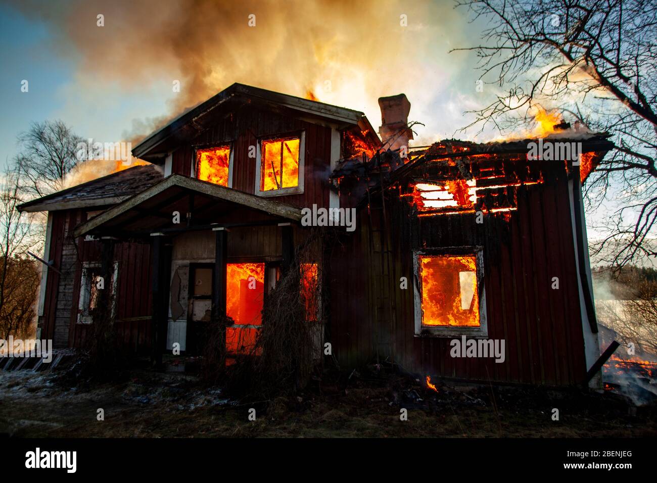 Firefighters trying to save burning house Stock Photo - Alamy