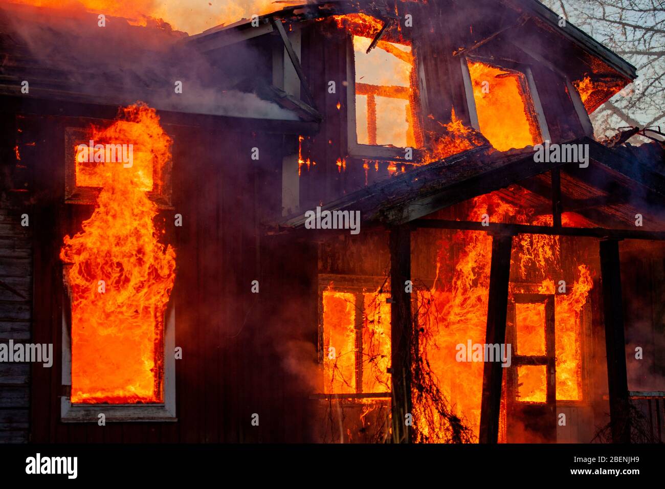 Firefighters trying to save burning house Stock Photo - Alamy