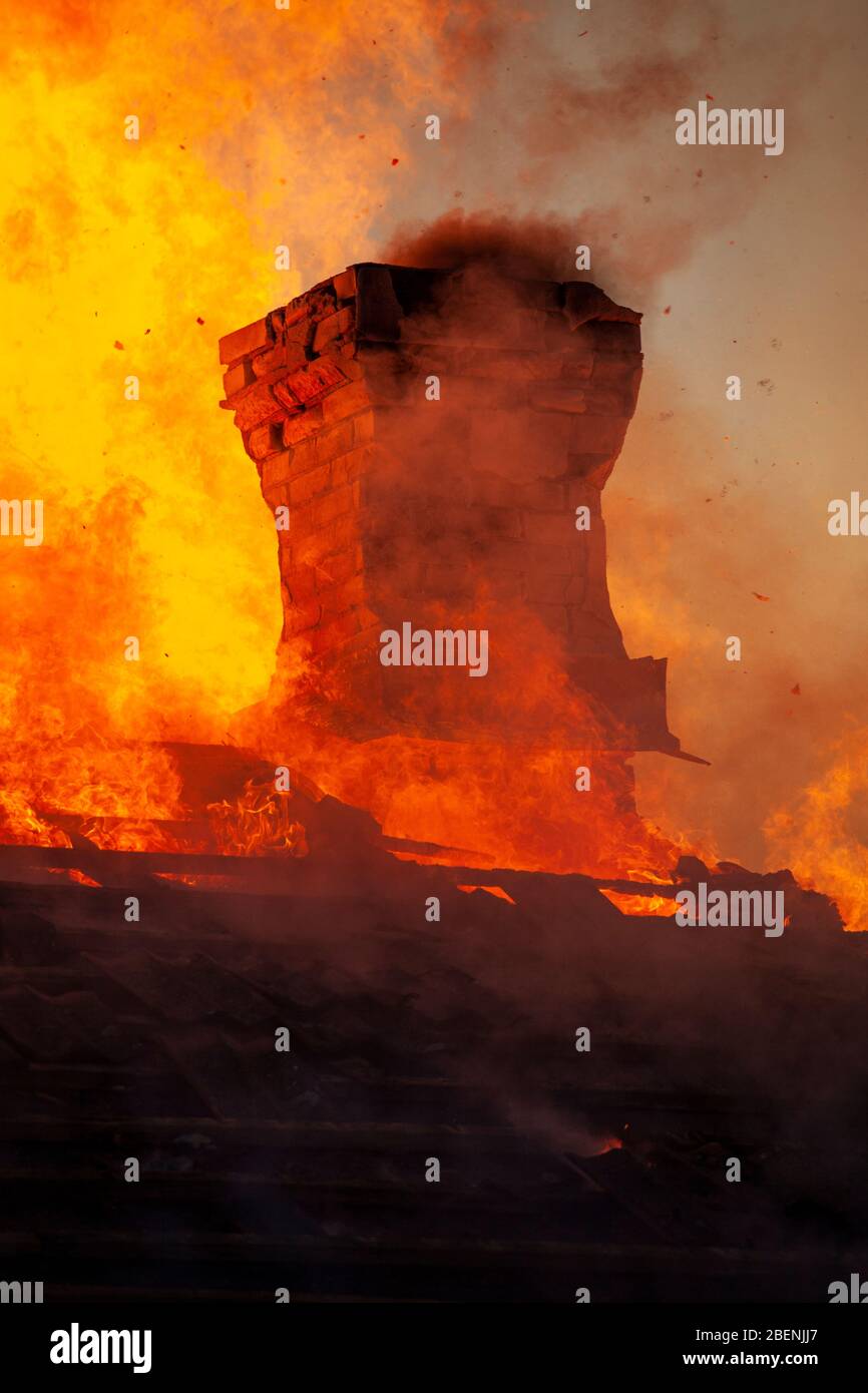 Firefighters trying to save burning house Stock Photo - Alamy