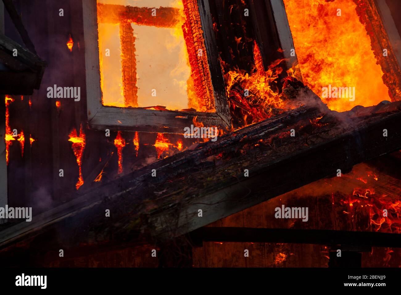Firefighters trying to save burning house Stock Photo - Alamy