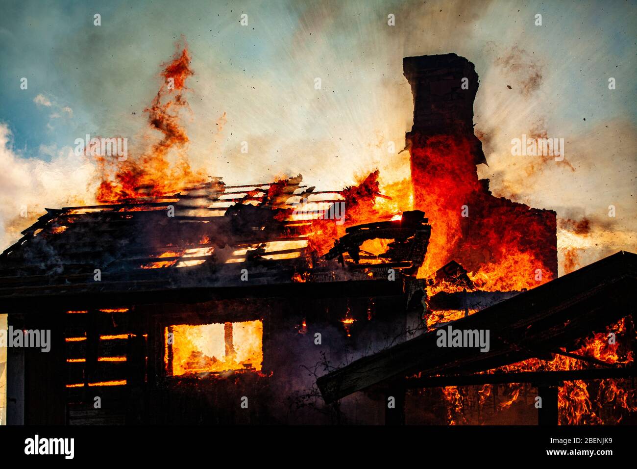 Firefighters trying to save burning house Stock Photo - Alamy