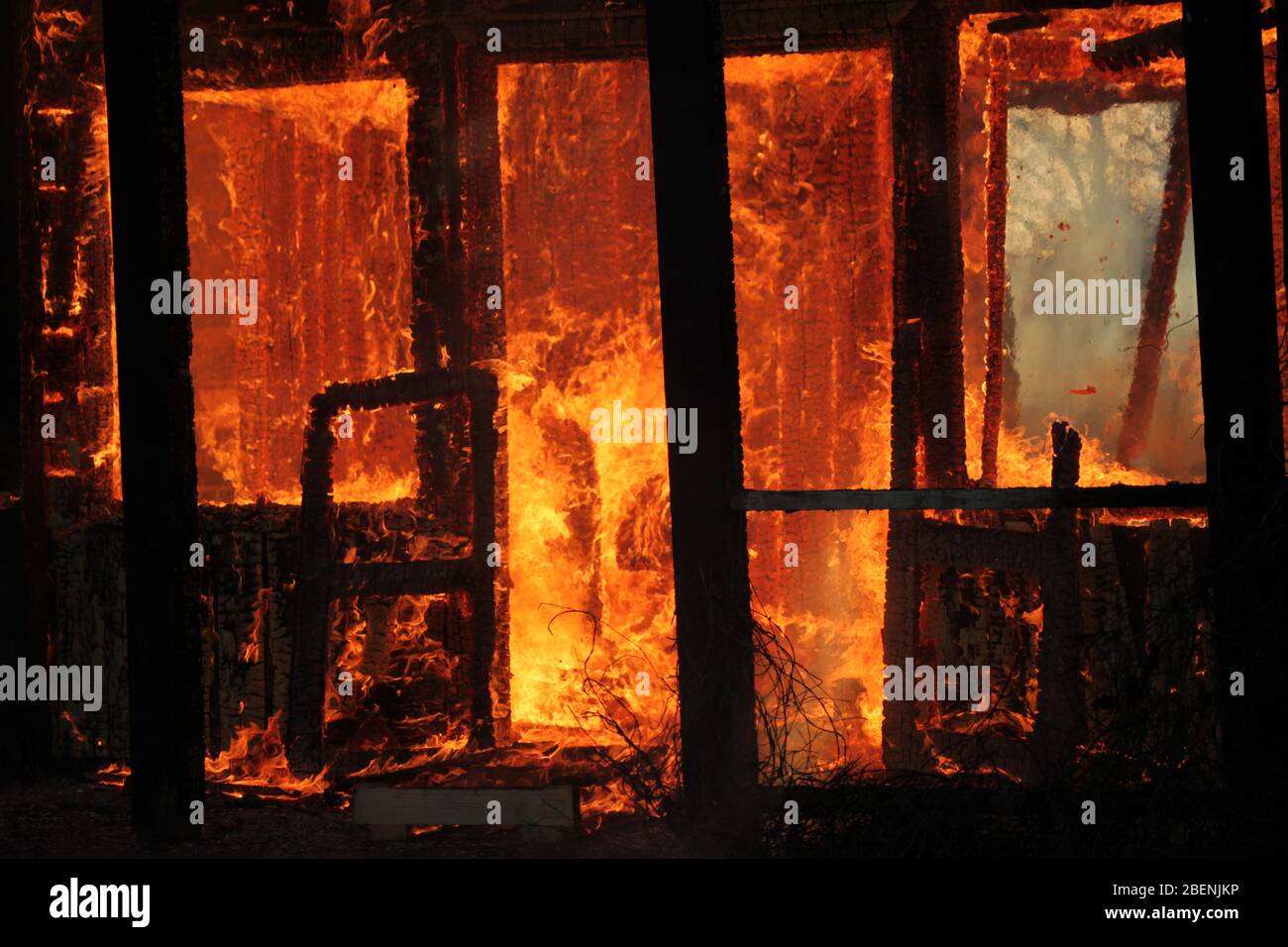 Firefighters trying to save burning house Stock Photo - Alamy