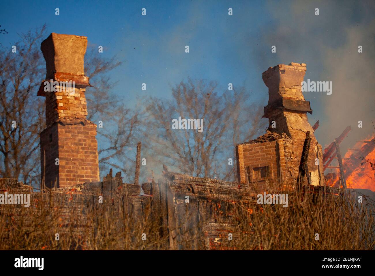 Firefighters trying to save burning house Stock Photo - Alamy