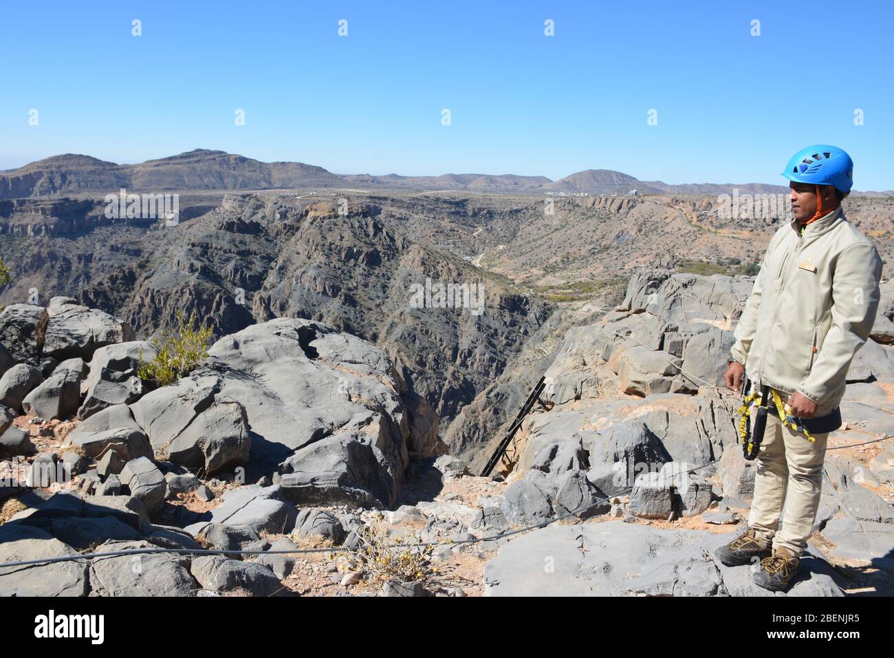 Male rock climbing and abseiling activity guide from the Anantara Al ...