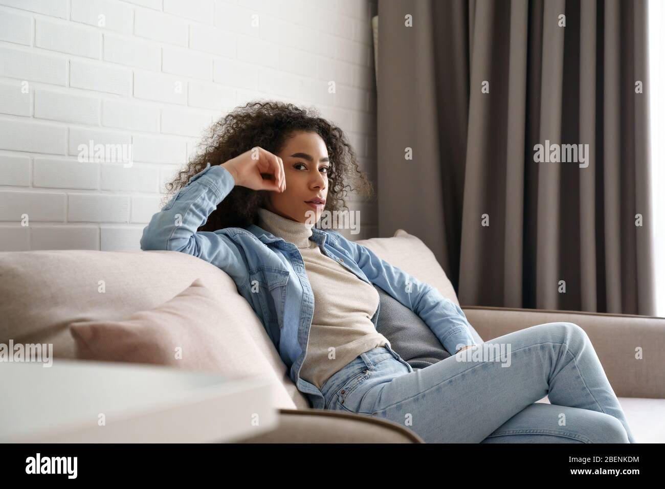 Relaxed african american woman lounge on comfortable sofa, portrait ...