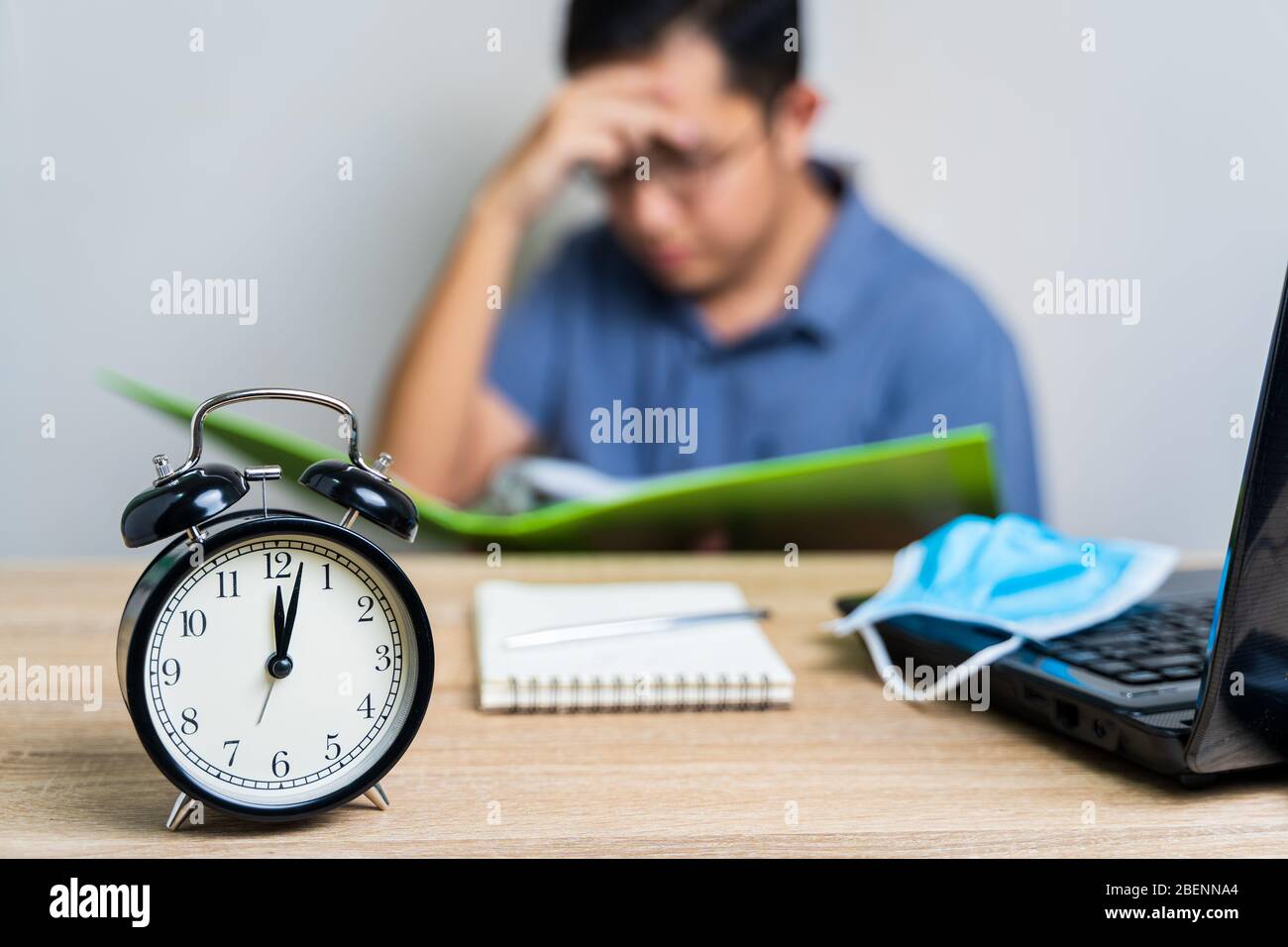 Stressed businessman alarm clock hi-res stock photography and images ...