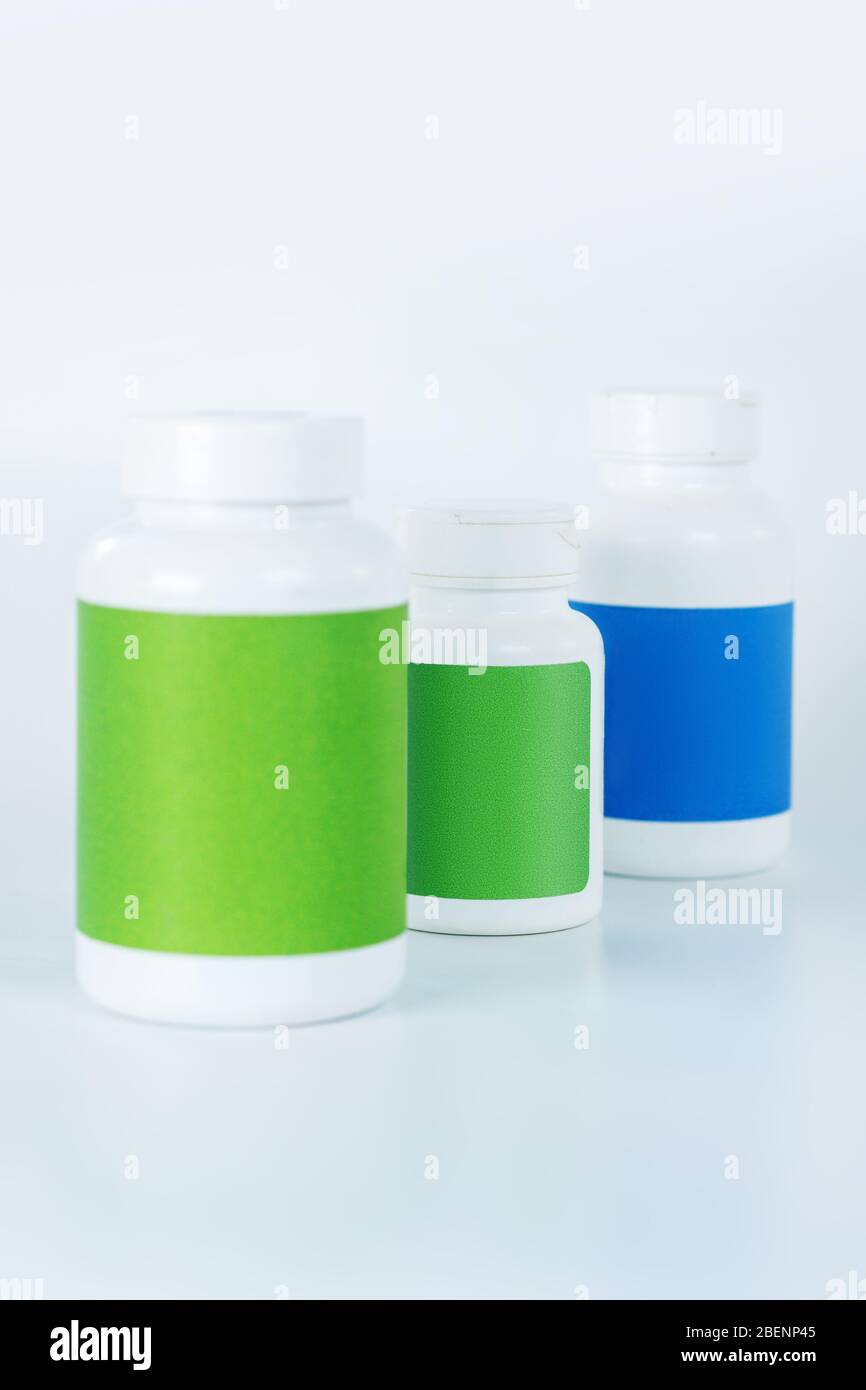Three bottles of vitamins in one row Stock Photo - Alamy