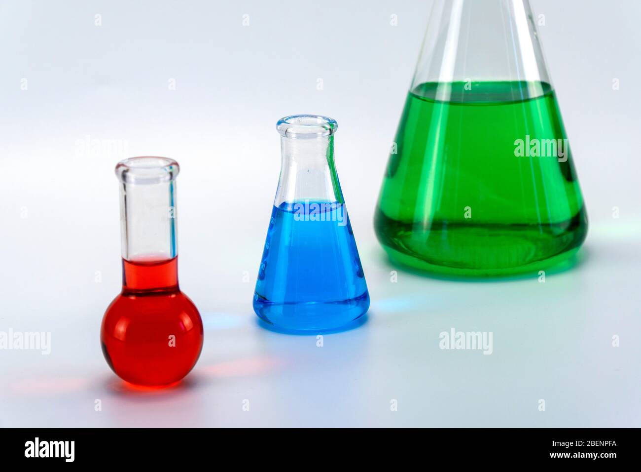 Laboratory glassware with liquid on white background. glass chemical ...