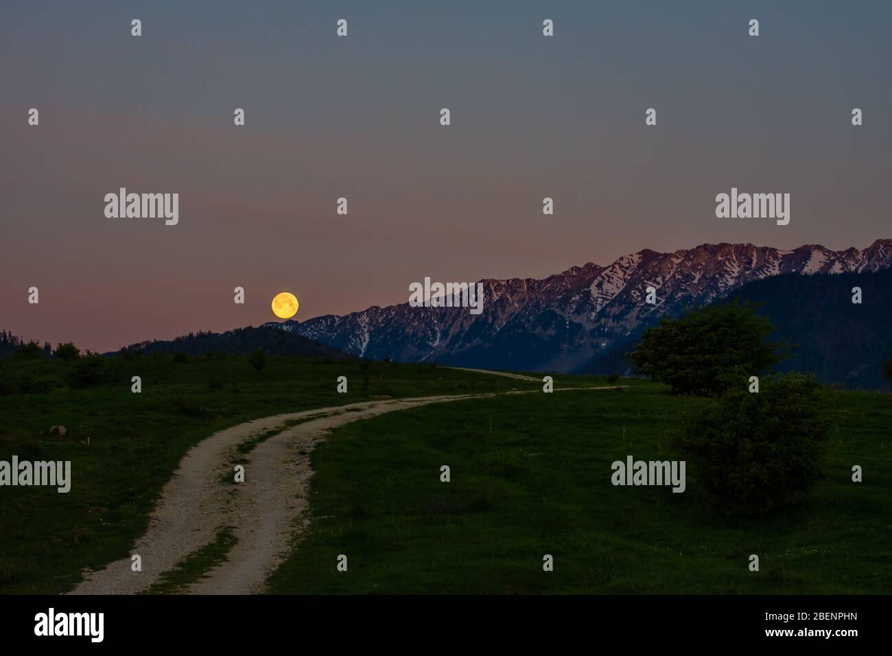 Moon rising over road hi-res stock photography and images - Alamy
