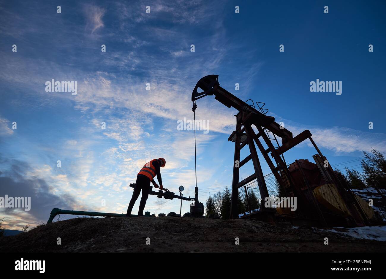 Working oil beam pump sunset hi-res stock photography and images - Alamy