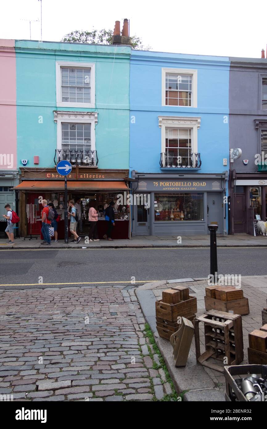 Portobello Road Market with colourful painted houses and antique shops ...