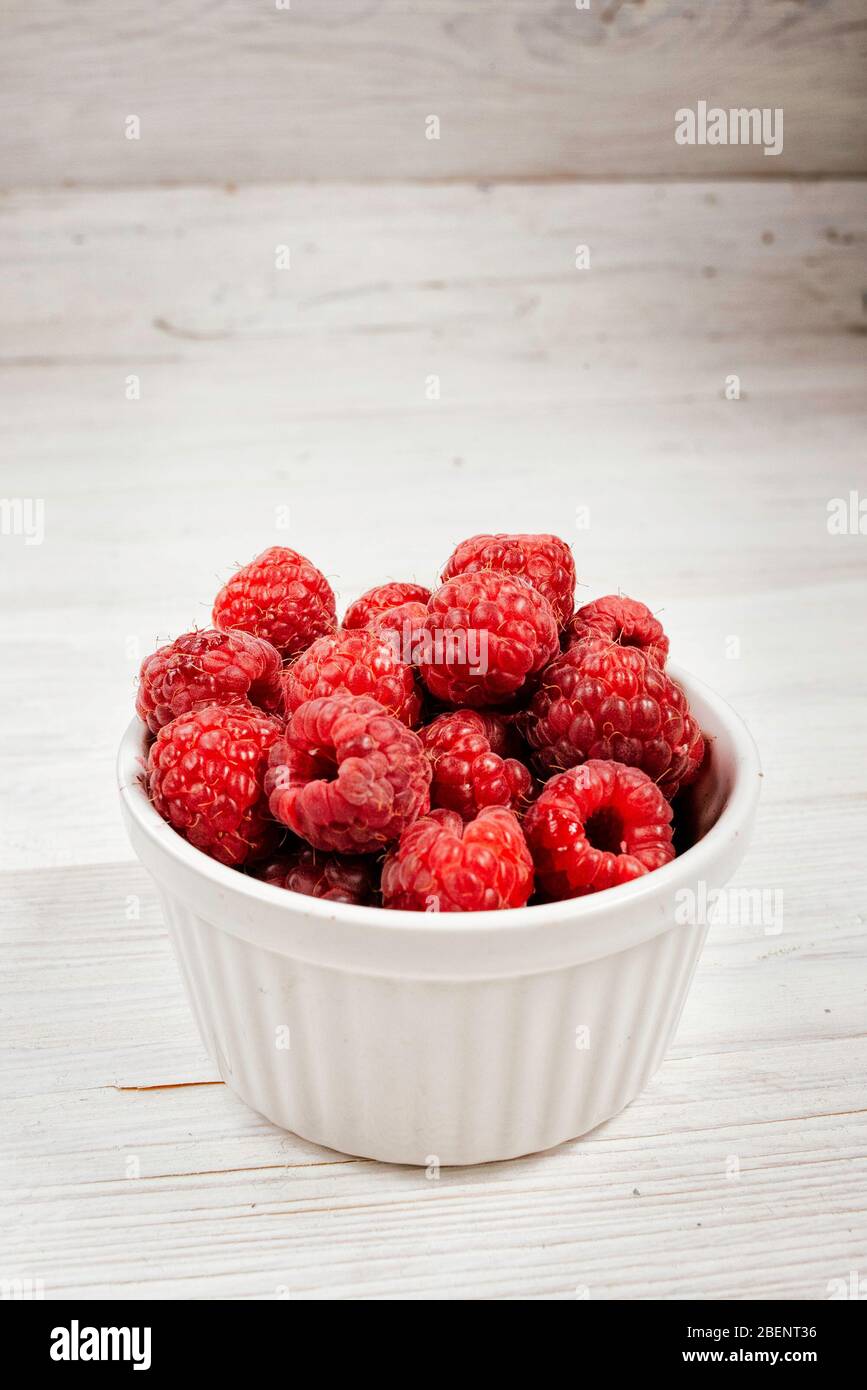 Raspberry with leaves over white background Stock Photo - Alamy