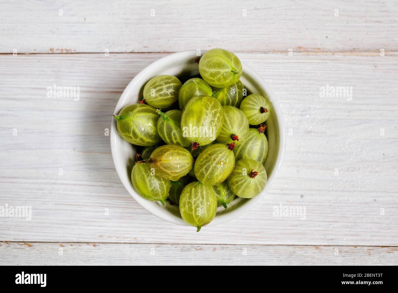 Set of organic gooseberry. Gooseberries fruits in a metal cup. Green ...