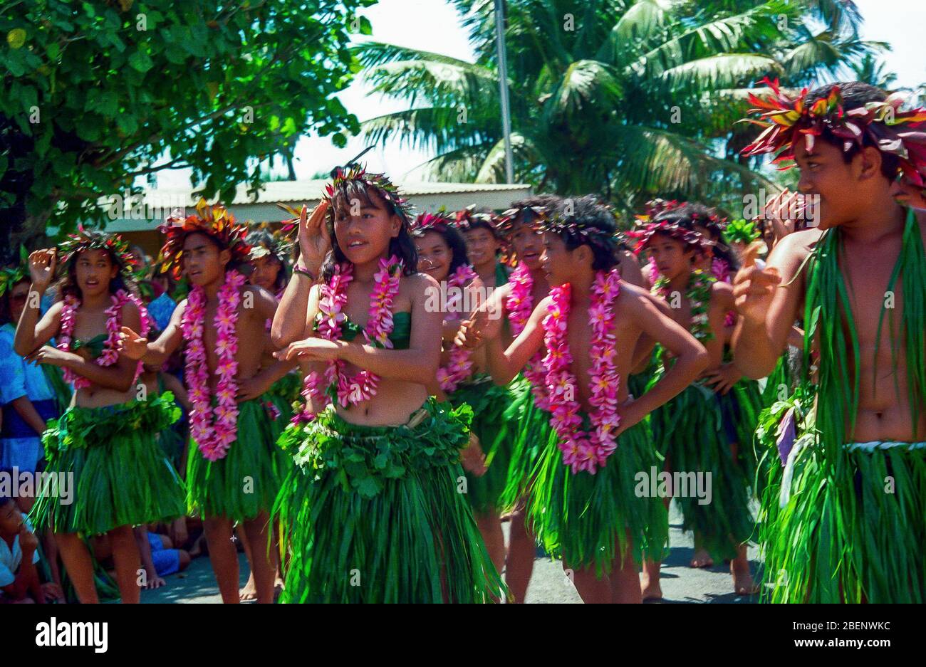 Polynesian dancers celebrate the launching of a traditional twin-hulled ...