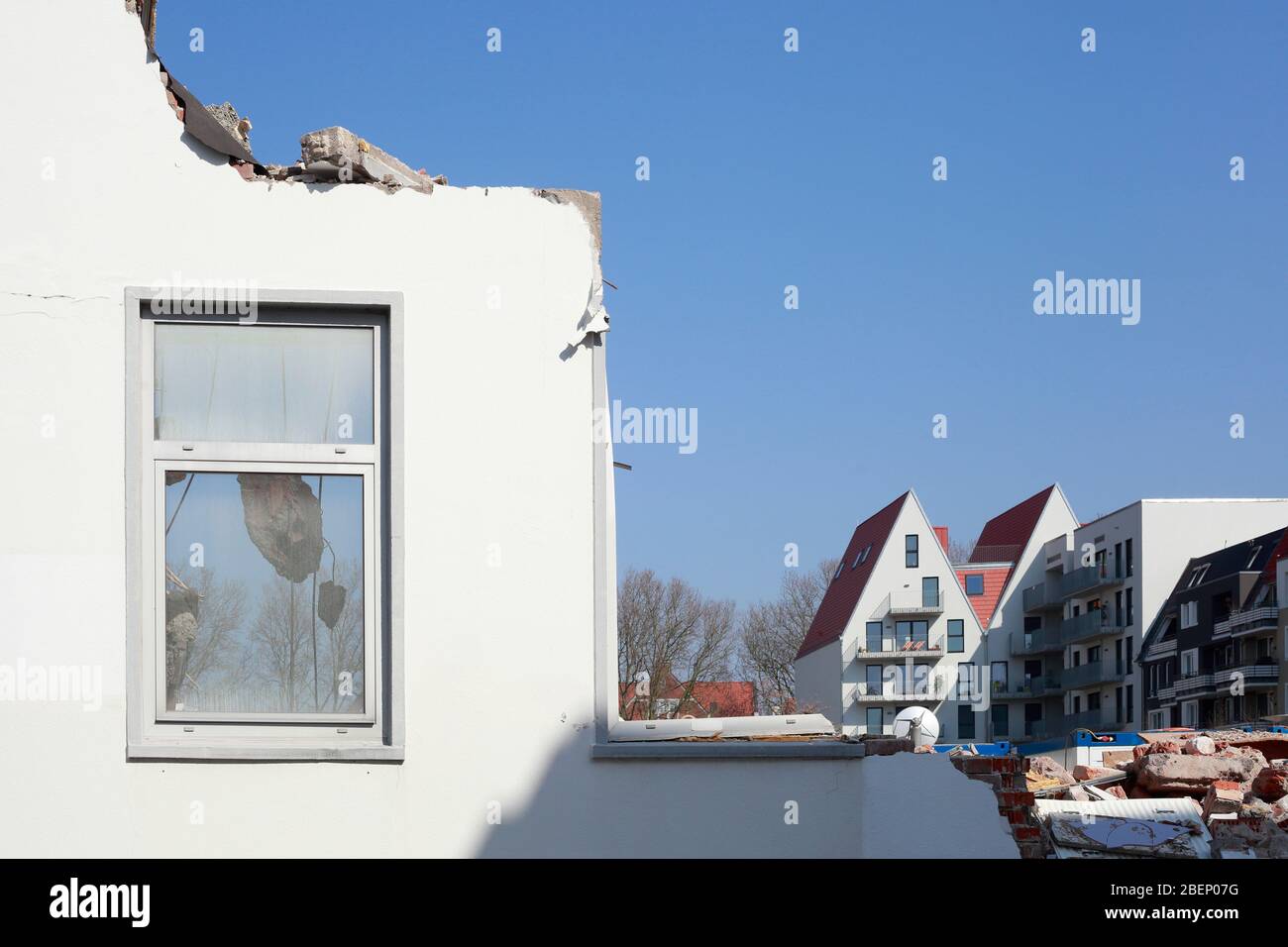 Old window with shattered glass on a demolition house, in the ...