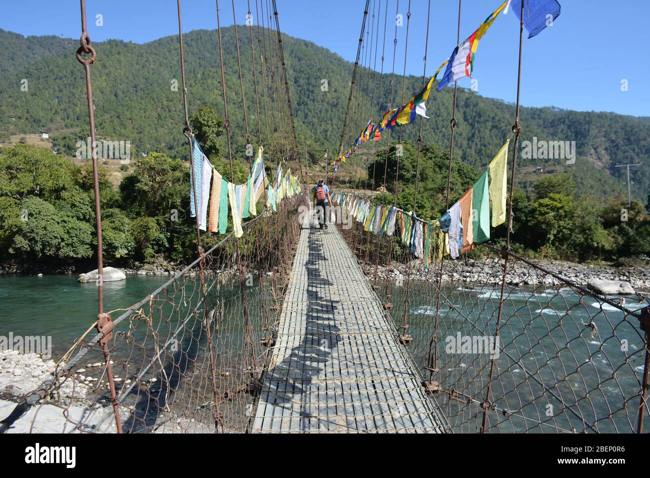 Suspension bridge over the The Mo Chhu river north of Punakha, Bhutan ...