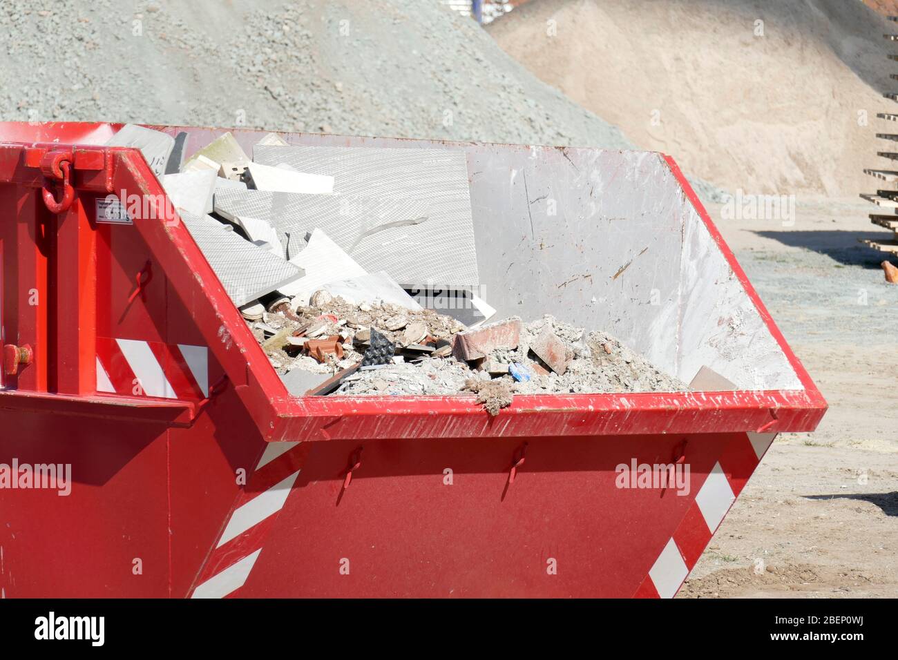 Red skip for building rubble, Germany, Europe Stock Photo - Alamy