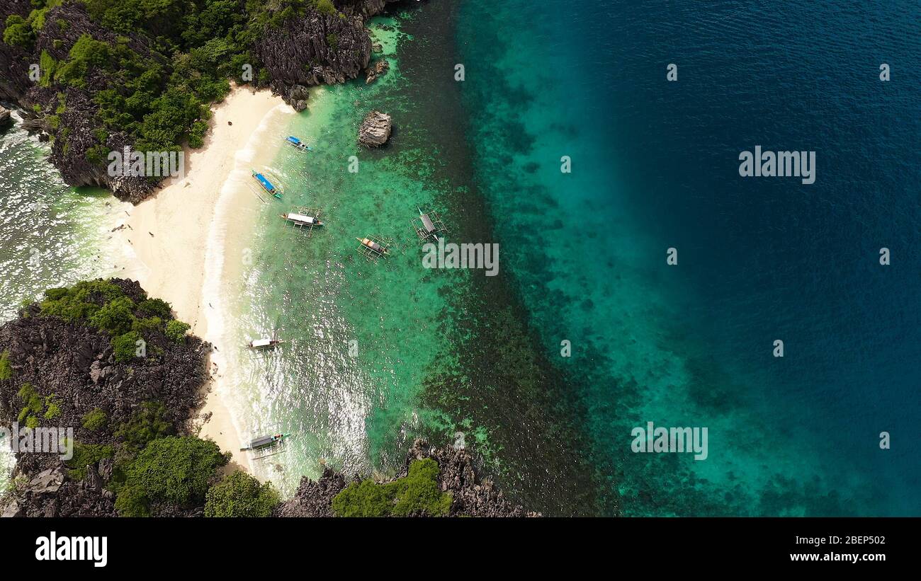 Travel concept: tropical sand beach and turquoise water view from the ...