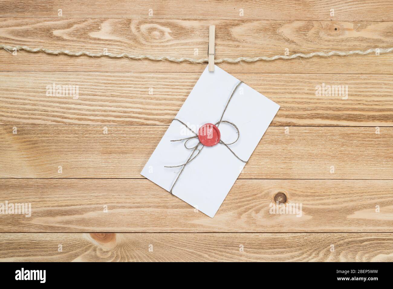 Mail envelope on rope Stock Photo - Alamy