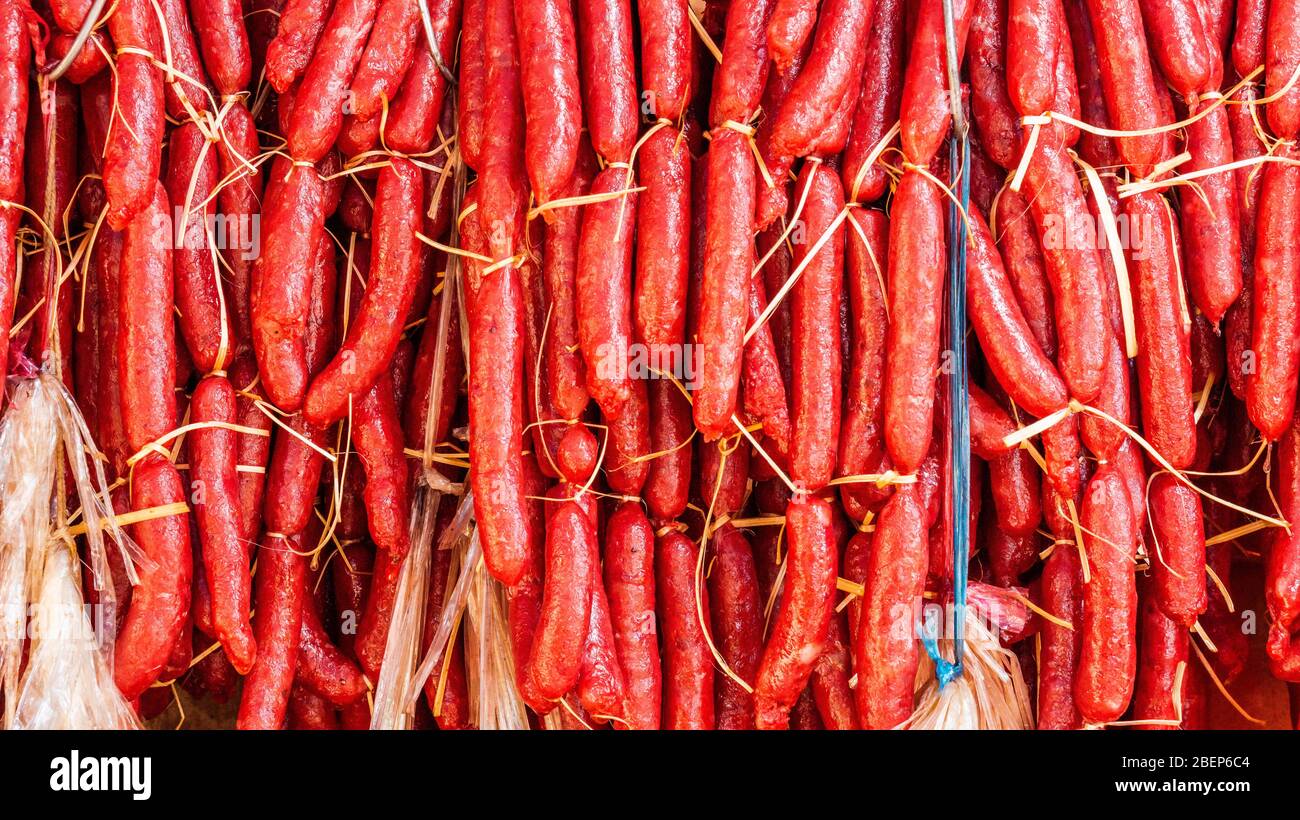 Red sausages hanging under the sun to make them dry Stock Photo - Alamy