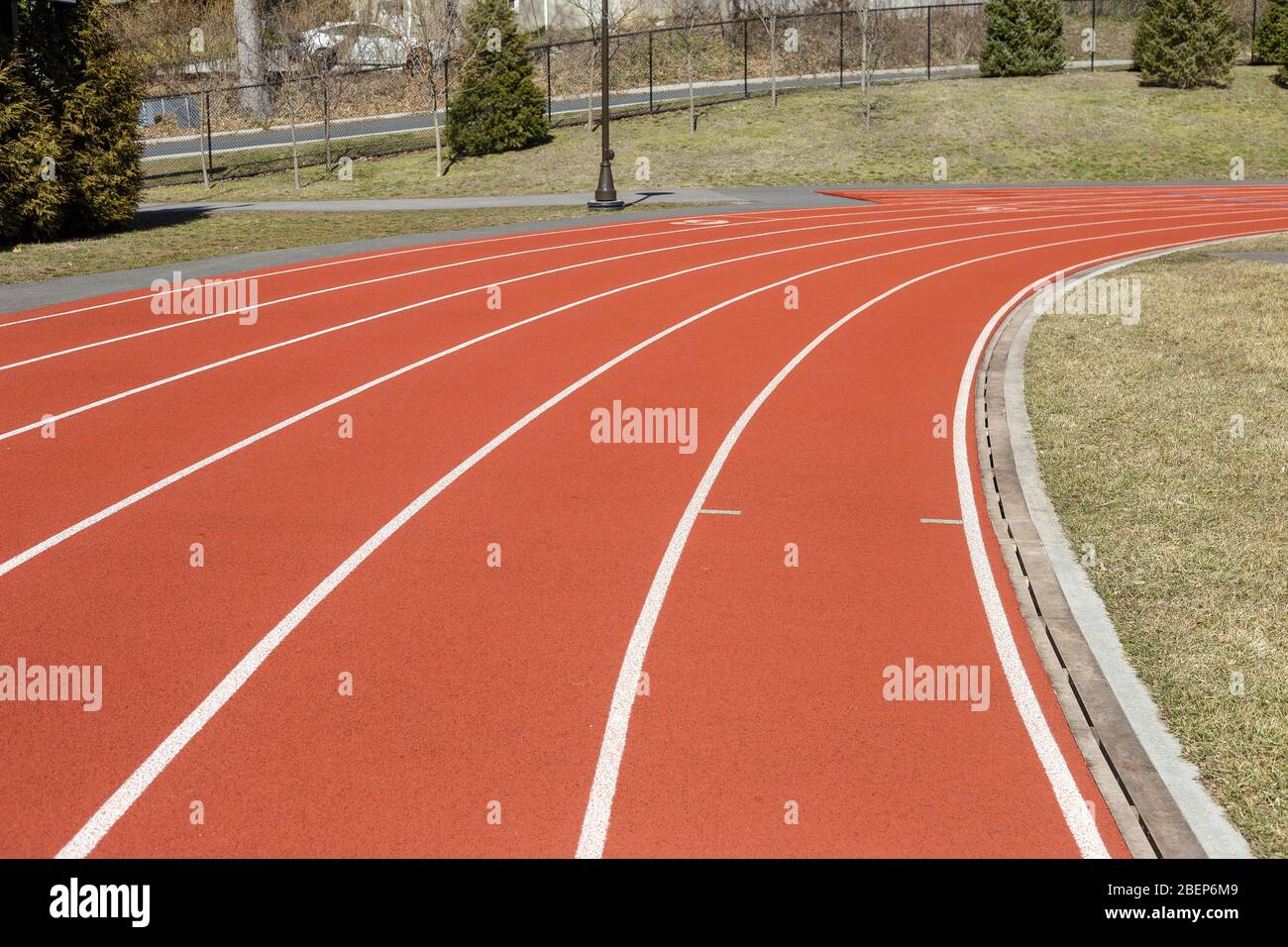 Red running track in school stadium. Sport recreation. Healthy ...