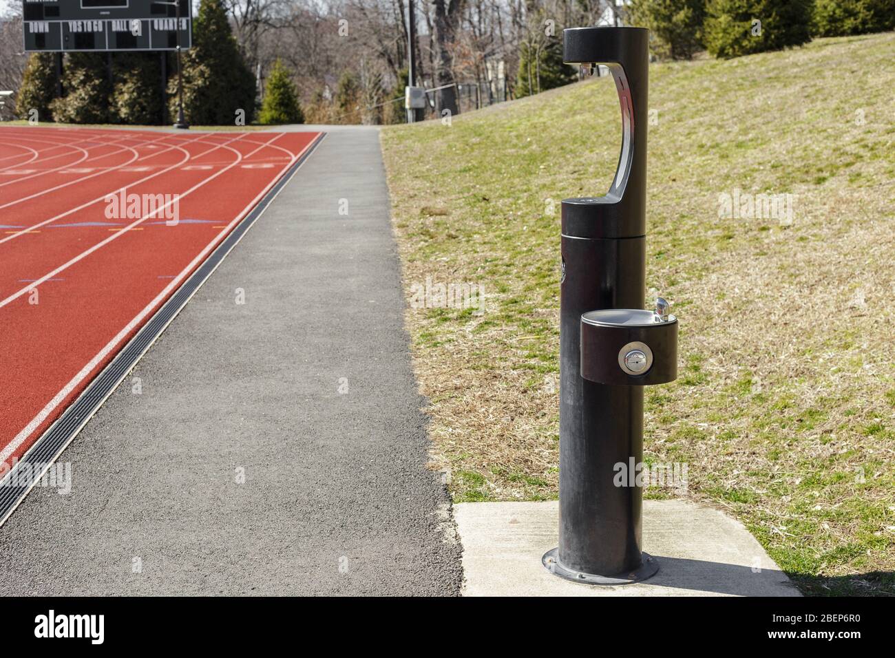 Public drinking water tap in school stadium. Sport recreation. Healthy ...