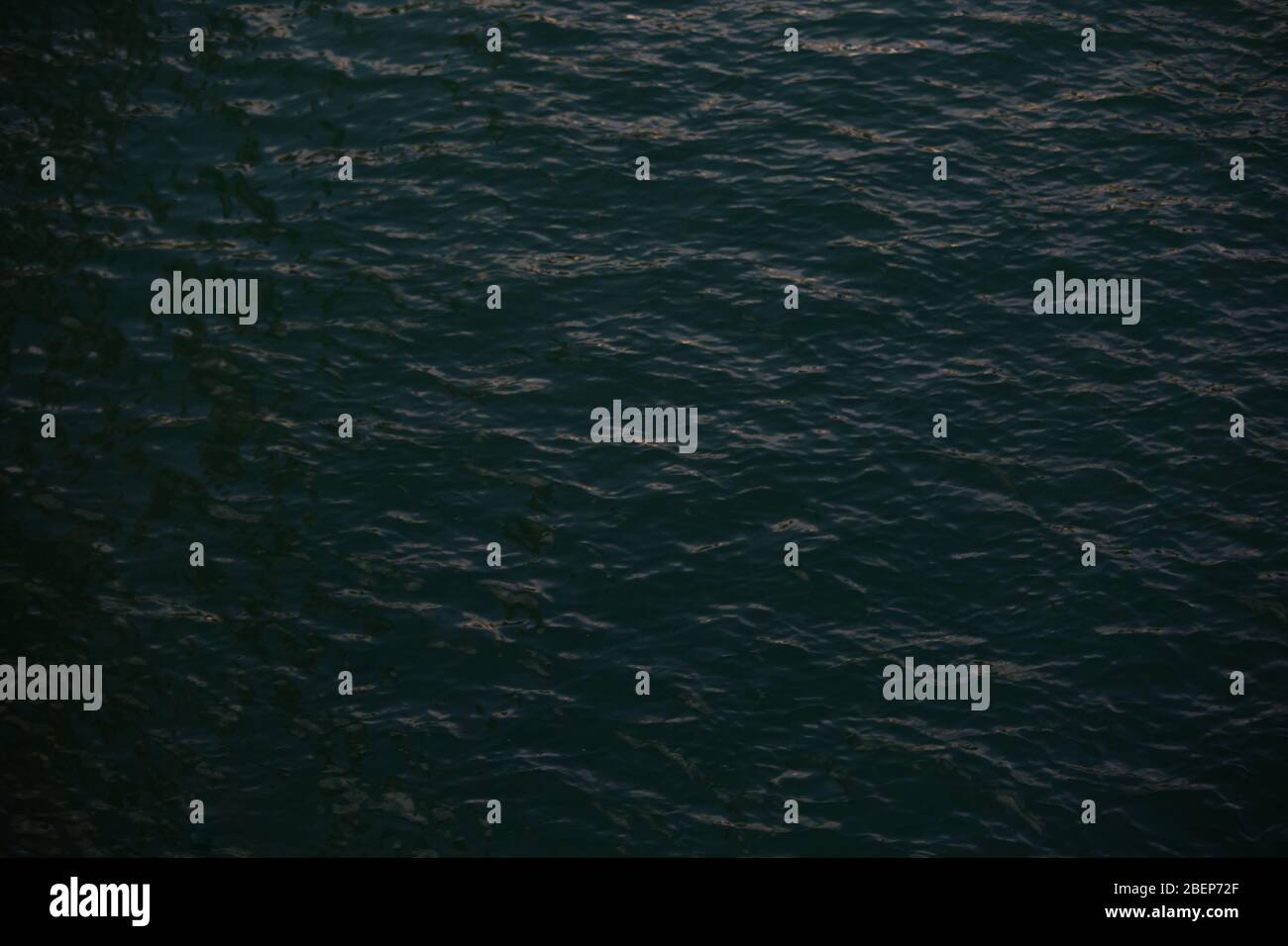 Vast blue ocean background with moderate waves looking straight down ...