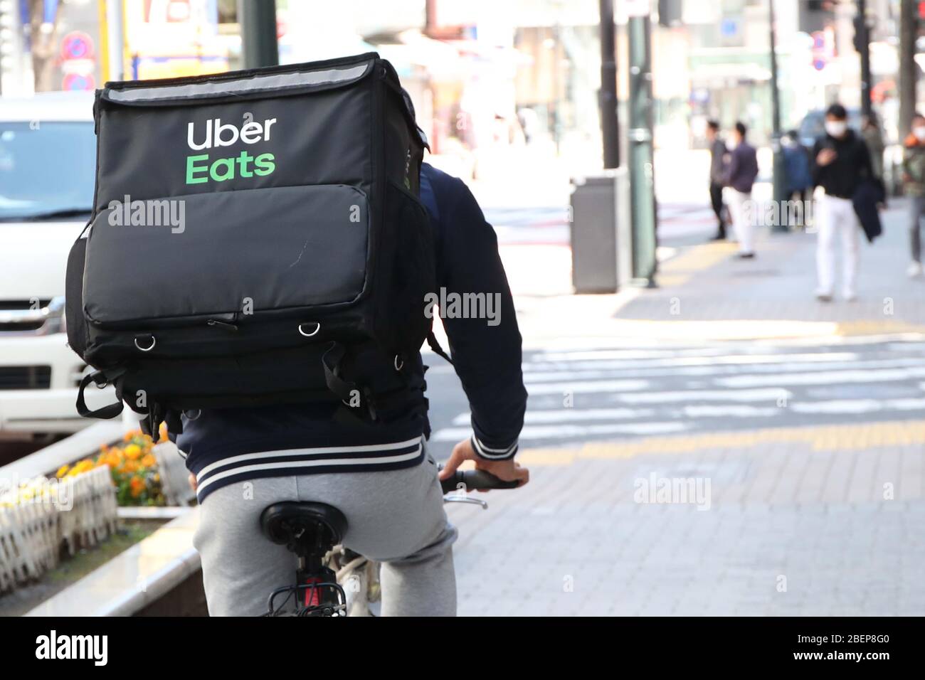 An Uber Eats food delivery courier is seen in Tokyo, Japan on April 11 ...