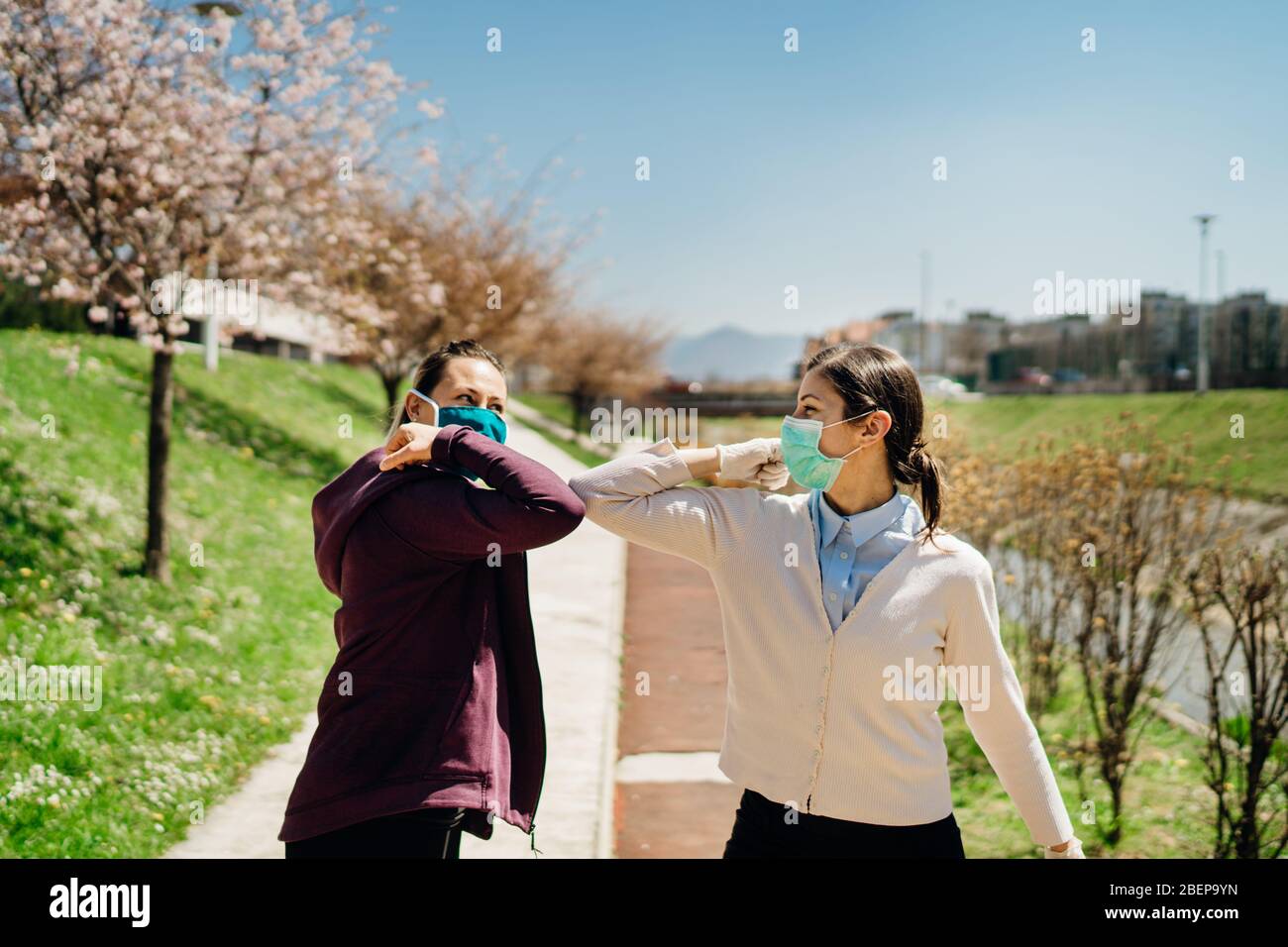 Elbow touching greeting hi-res stock photography and images - Alamy