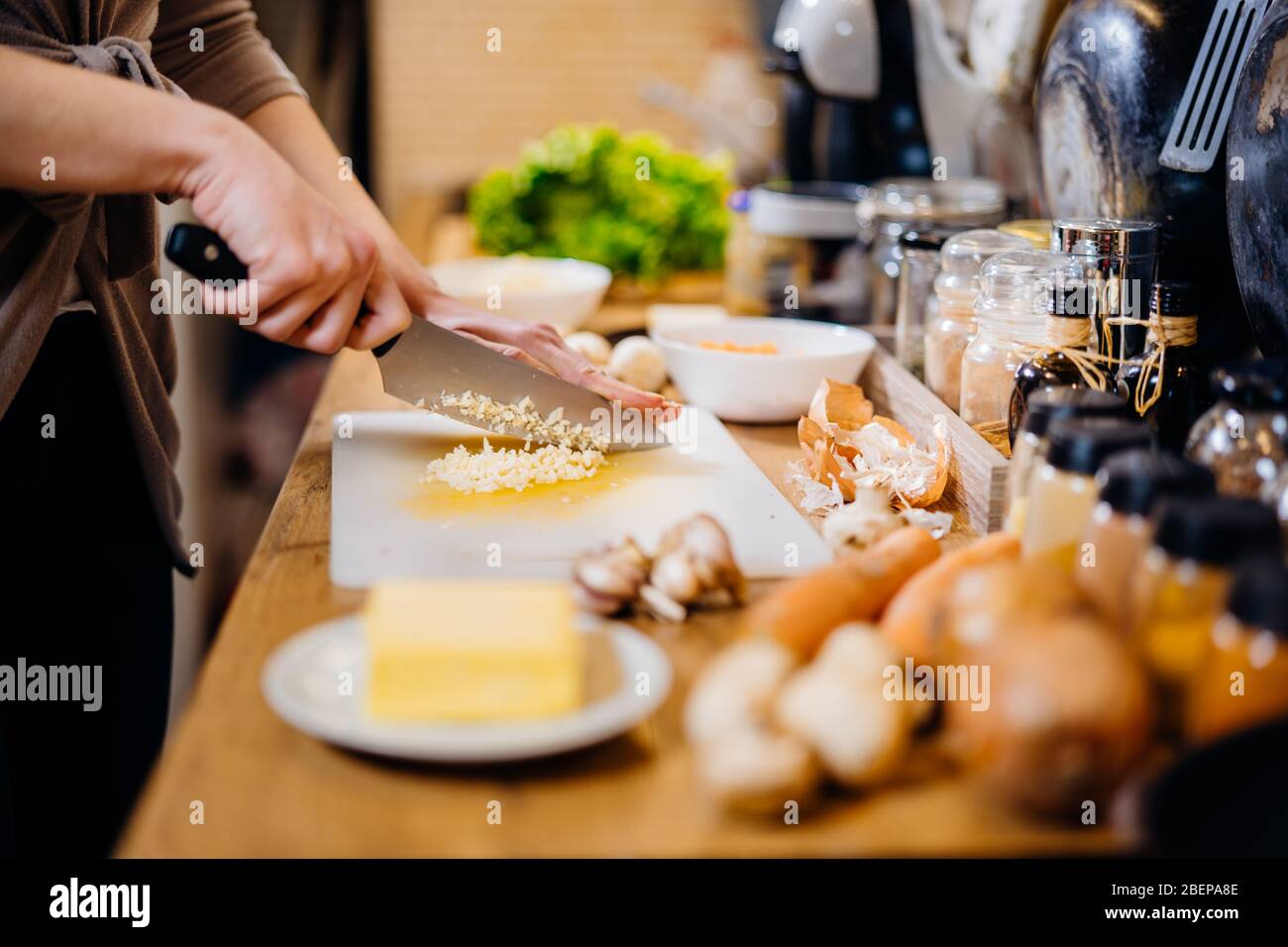 Chopping fresh garlic.Ingredients for cooking food with garlic.Healthy ...