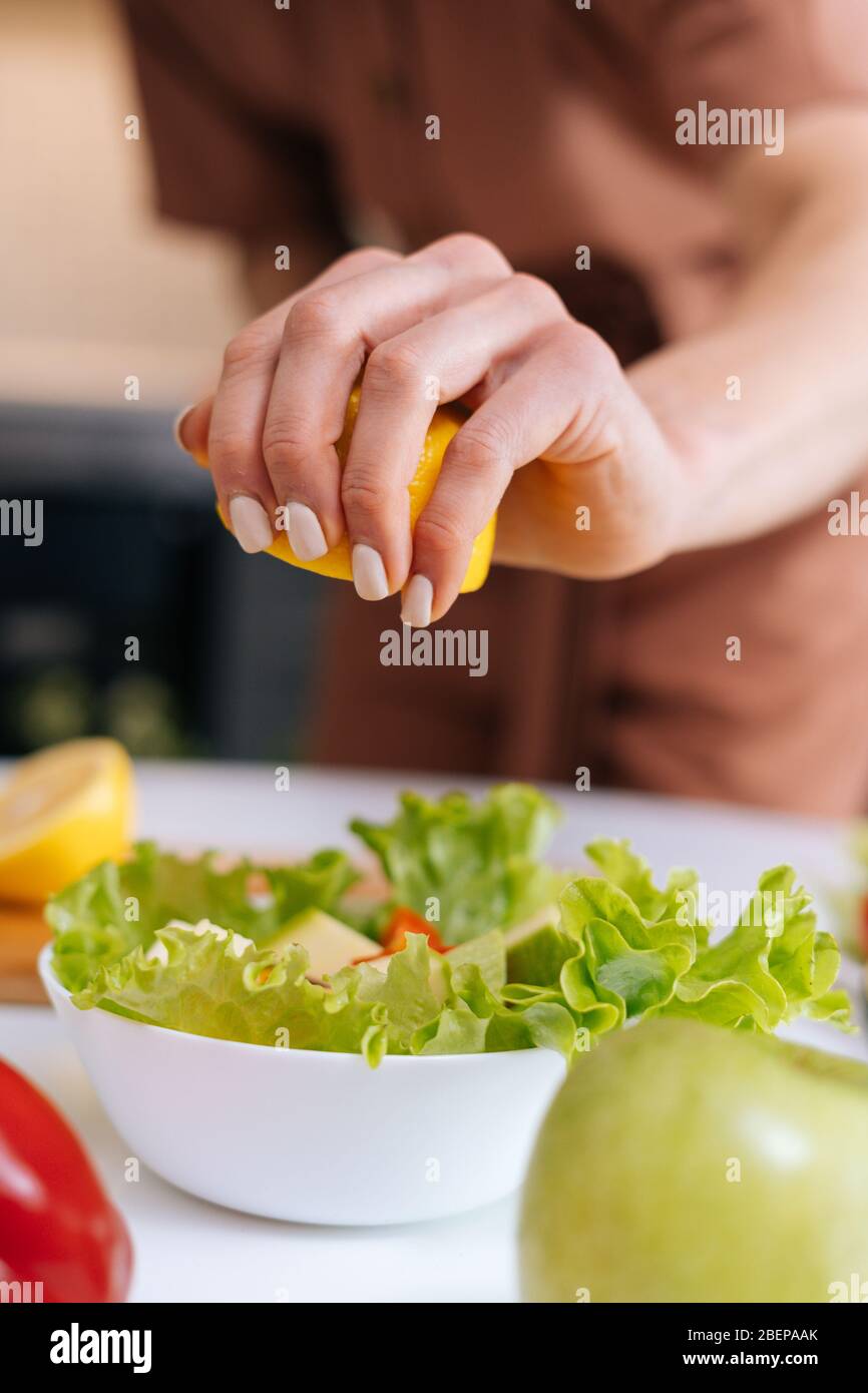 Woman squeeze lemon hand hi-res stock photography and images - Alamy