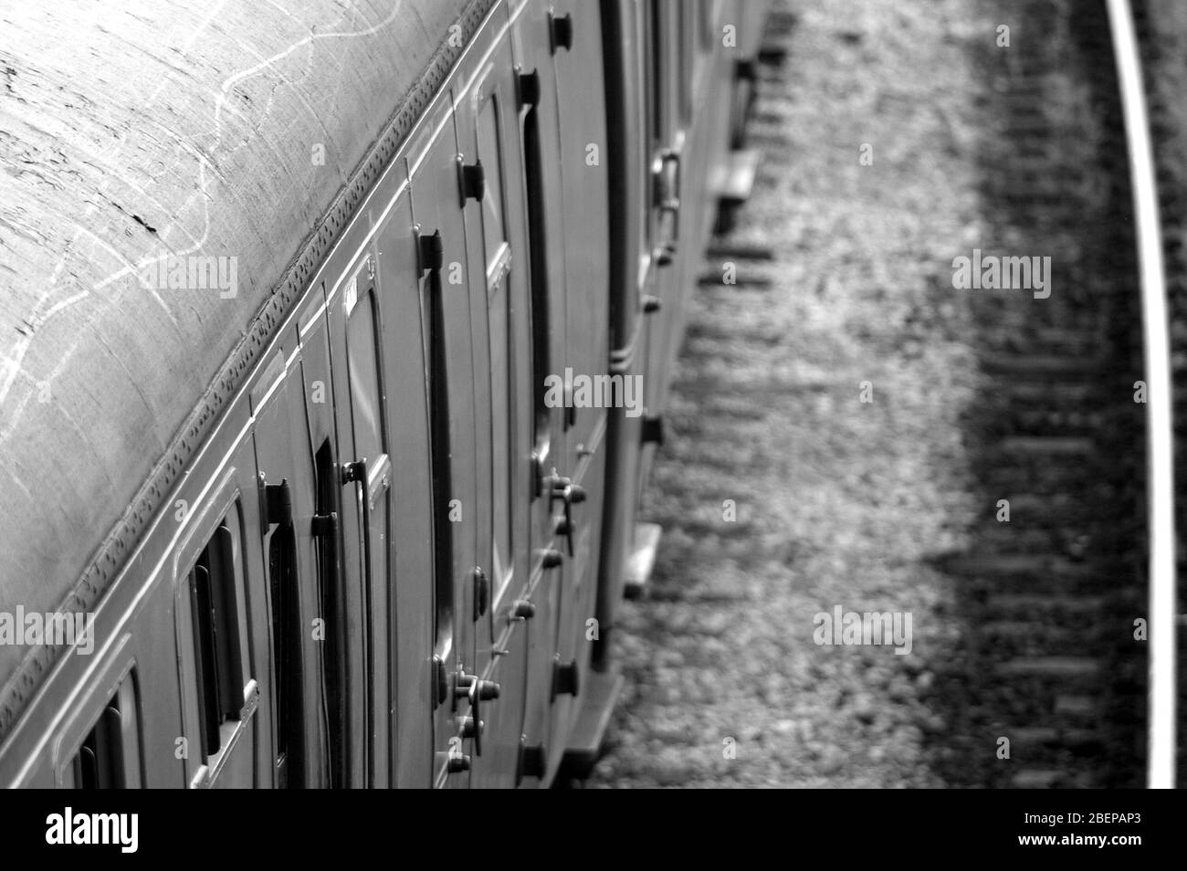 Black and white close-up of old railway carriages on a vintage railway ...