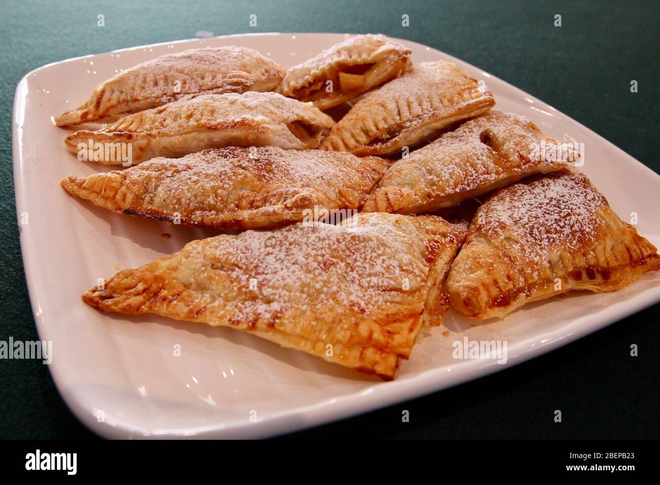 Homemade apple turnover with icing sugar Stock Photo - Alamy