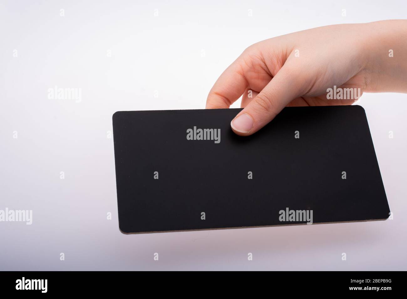 Rectangular shaped black notice board in hand on white background Stock ...