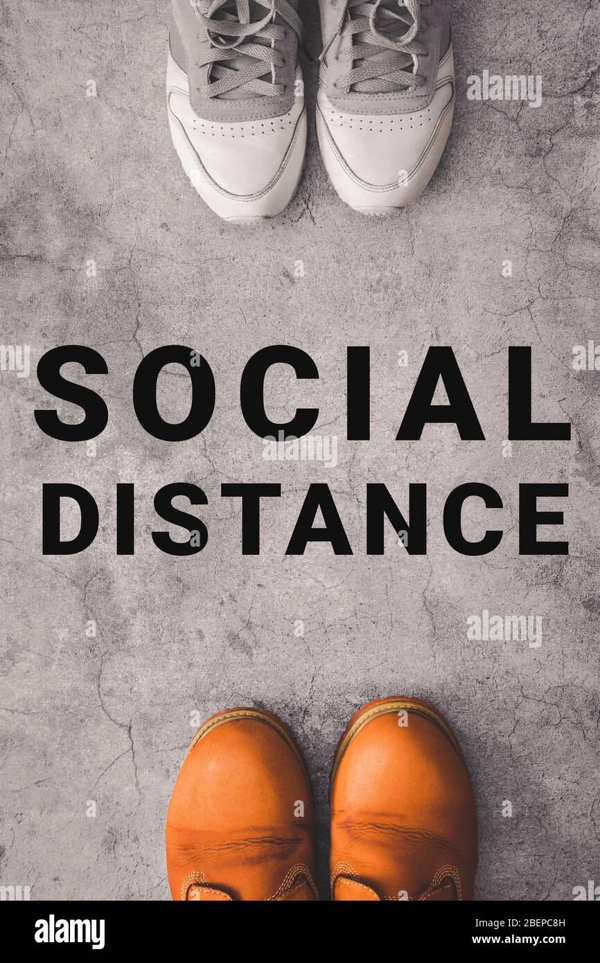 Social distance concept. Vertical photo of two person stay away each ...