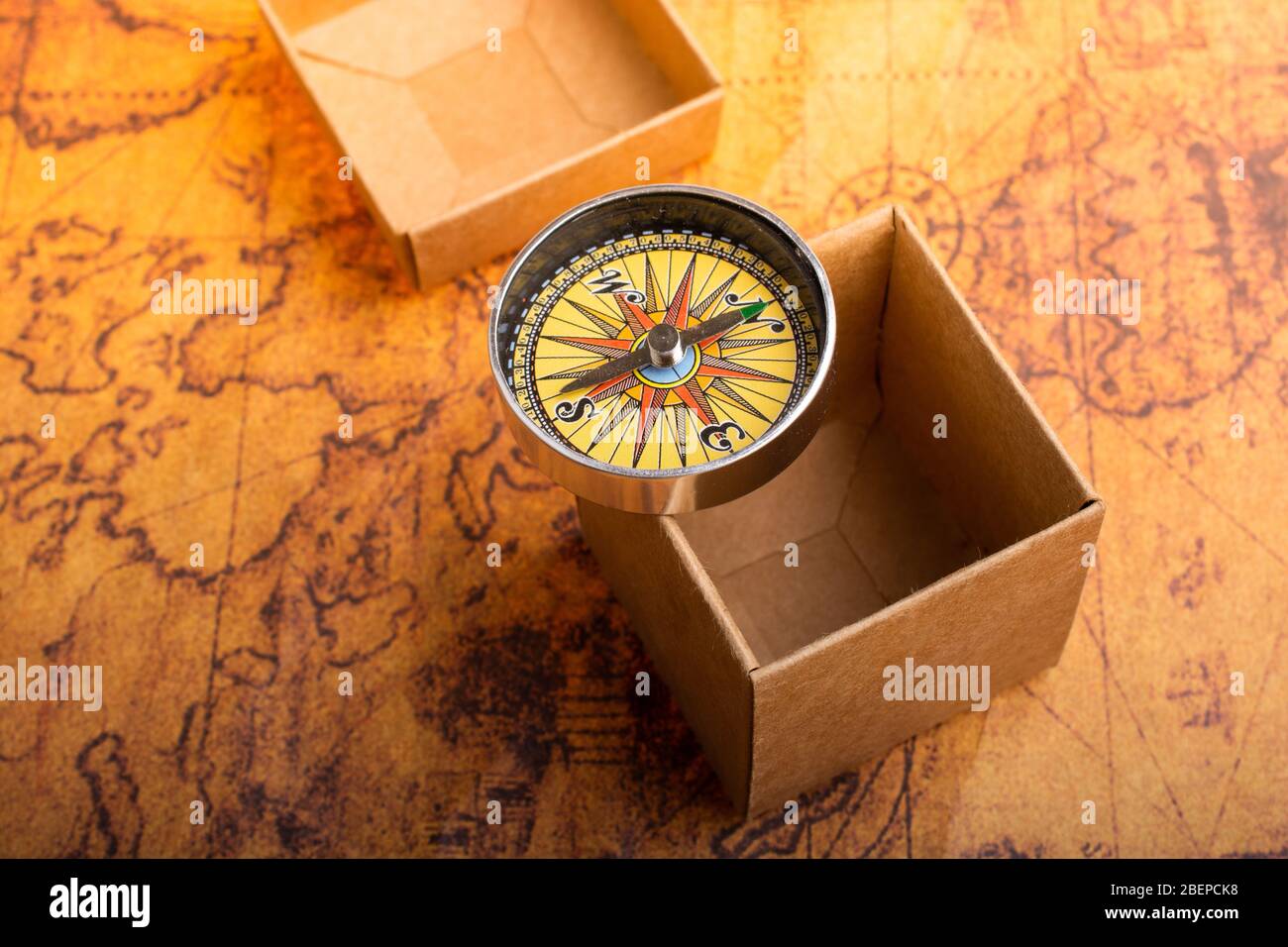 Compass on old map beside a box as a concept of traveling Stock Photo ...
