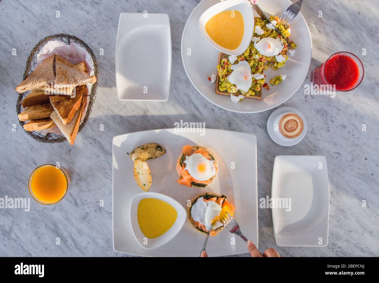 Healthy breakfast with poached eggs and toast. Top view of table with ...