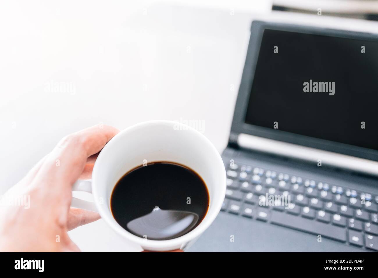 Person working having a coffee break Stock Photo - Alamy