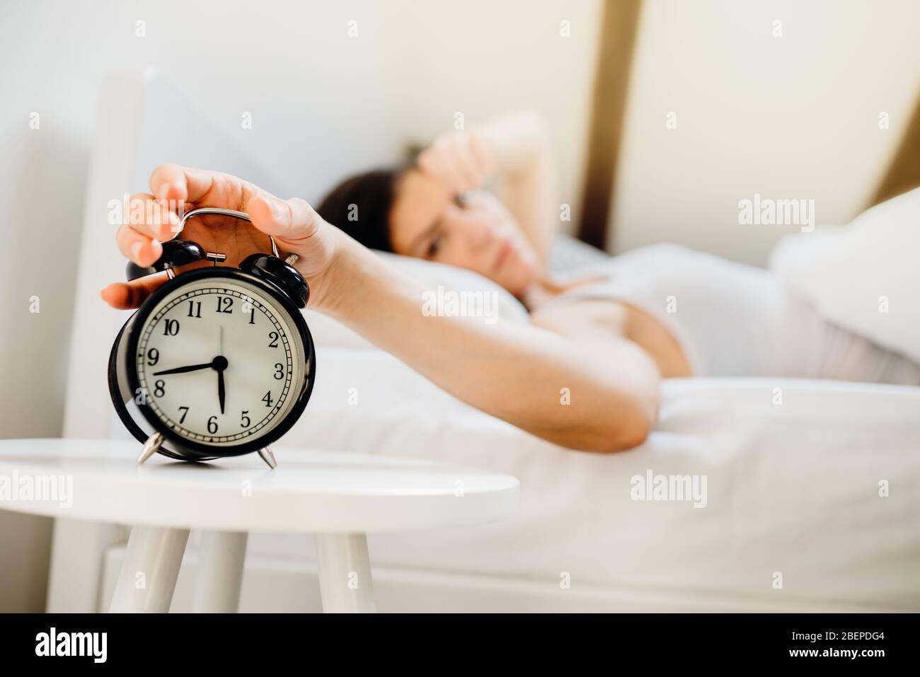 Alarm Clock Ringing Woman Waking Up In Early Morning For Work Sleeping