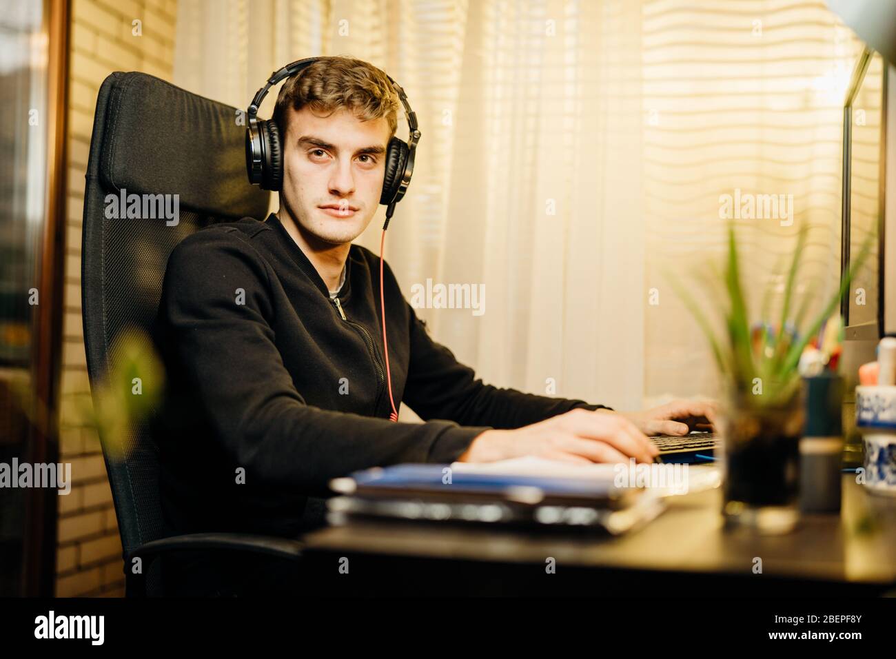 Professional esport gamer with headphones playing competitive internet ...