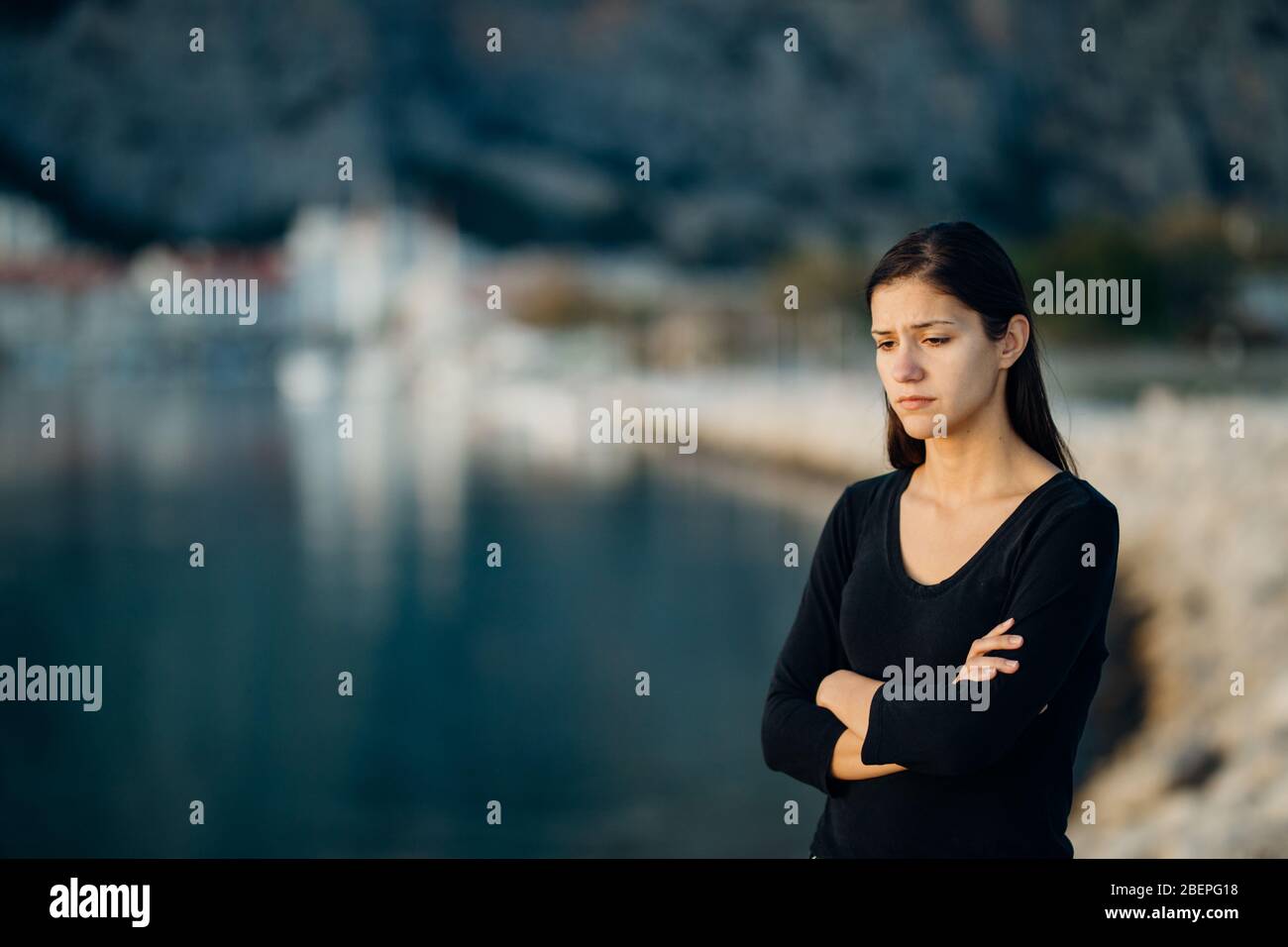 Stressed sad woman in bad mood overthinking problems,looking at the sea ...