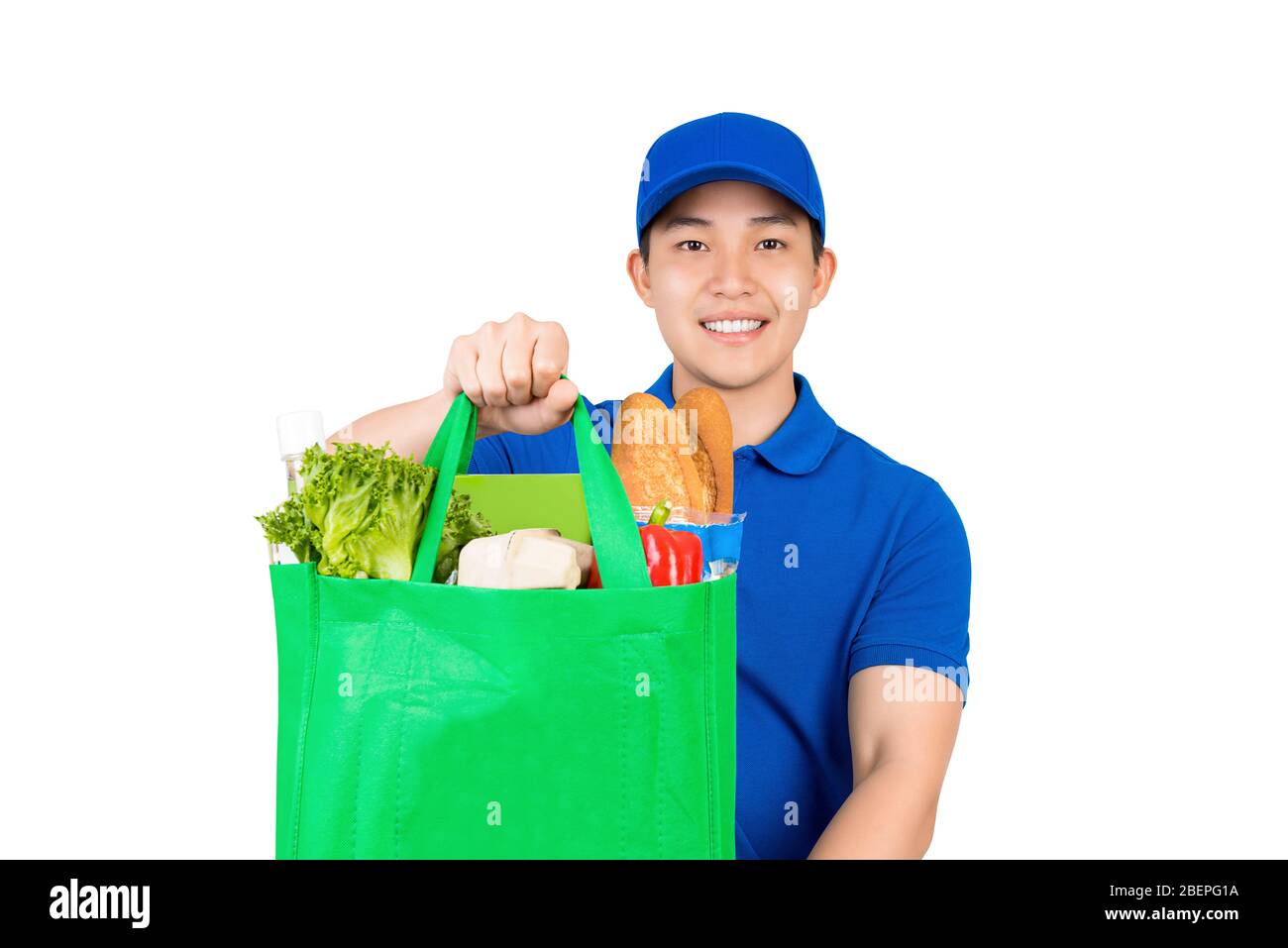 Smiling handsome Asian delivery man holding grocery shopping bag giving ... Smiling handsome Asian delivery man holding grocery shopping bag giving ...