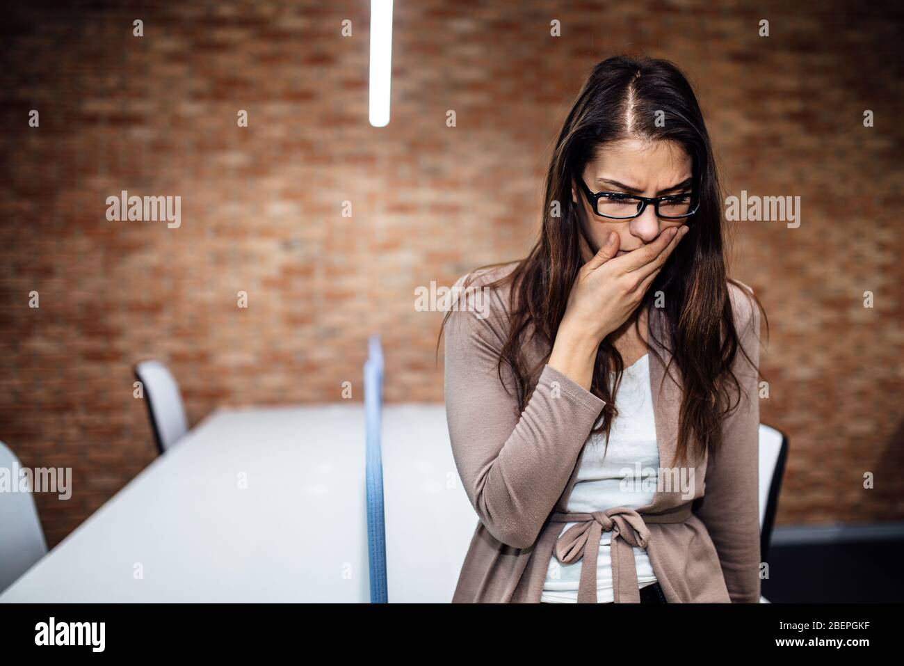 Business woman in empty office having emotional mental problems ...