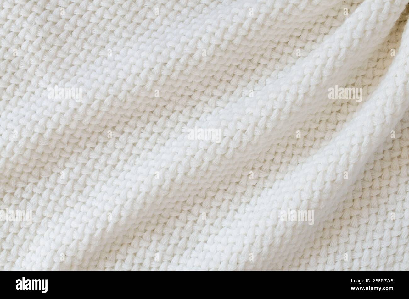 Beige knitted woolen background. Knitwear fabric texture. Scandinavian ...